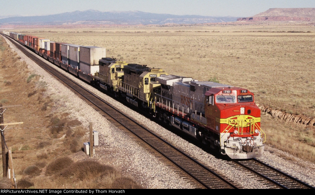 BNSF 710 heads up an eastbound intermodal of COFCs